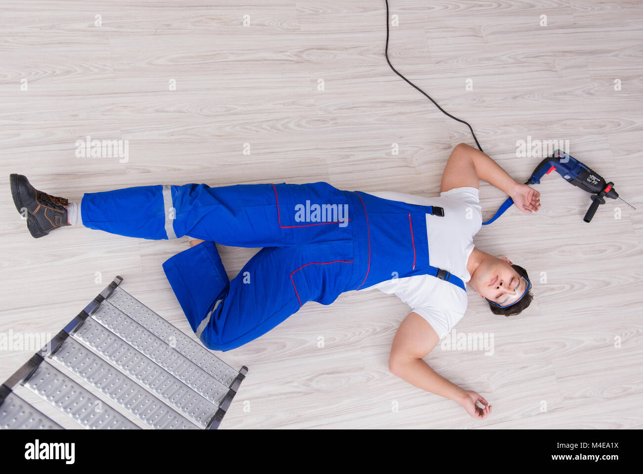 Worker after falling from height - unsafe behavior Stock Photo - Alamy