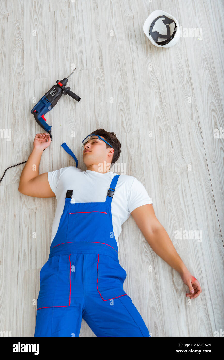 Worker after falling from height - unsafe behavior Stock Photo - Alamy