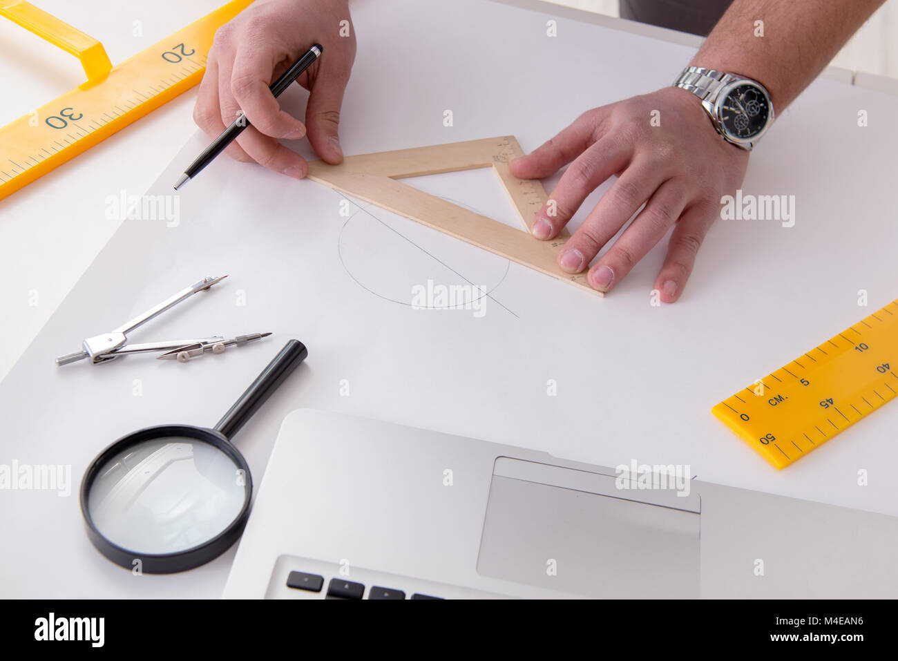 Male engineer working on drawings and blueprints Stock Photo - Alamy