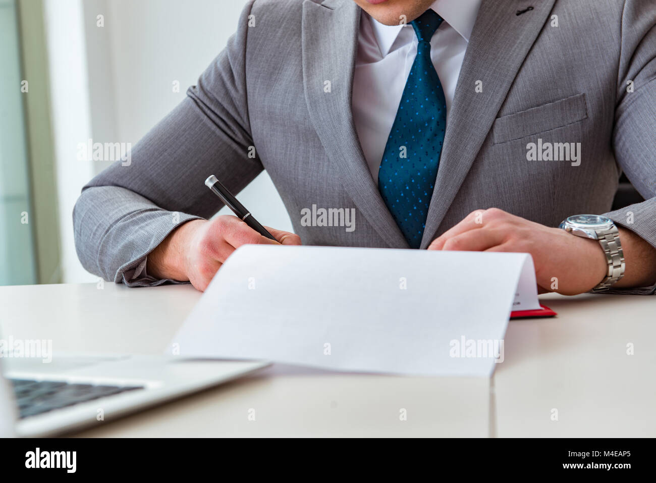 Businessman taking notes at the meeting Stock Photo - Alamy