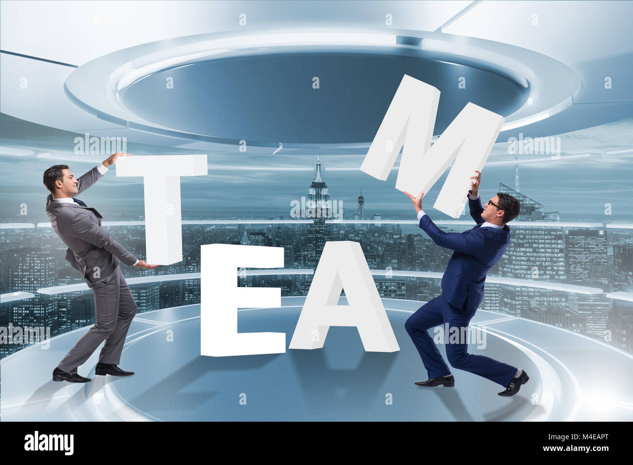 Teamwork concept with businessman putting letters Stock Photo - Alamy