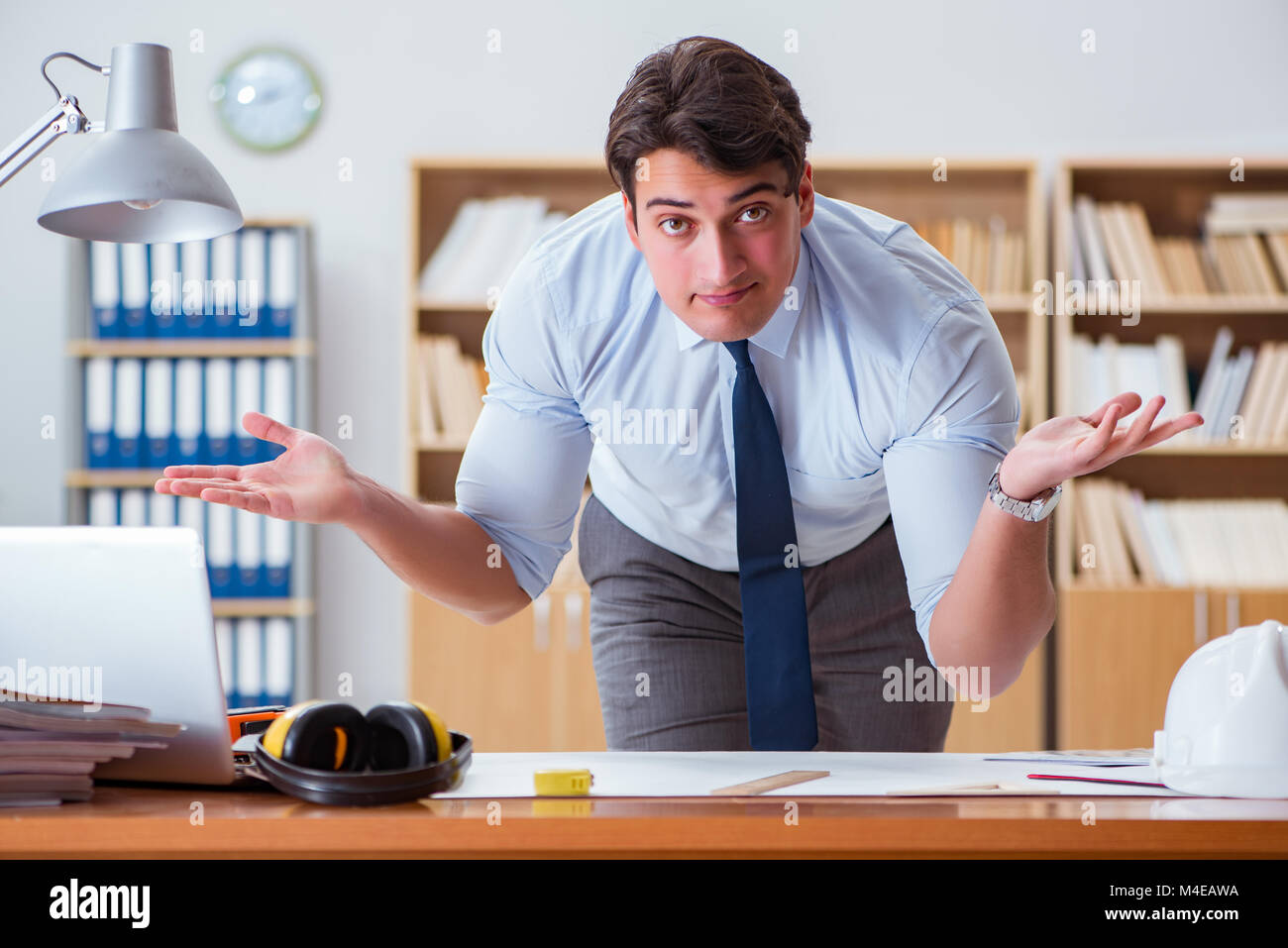 Engineer supervisor working on drawings in the office Stock Photo - Alamy