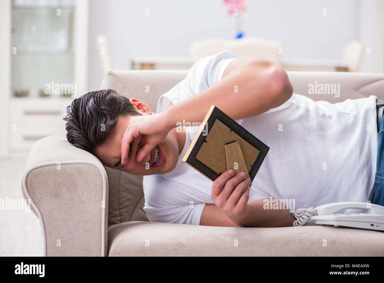 Young man in sad saint valentine concept Stock Photo - Alamy
