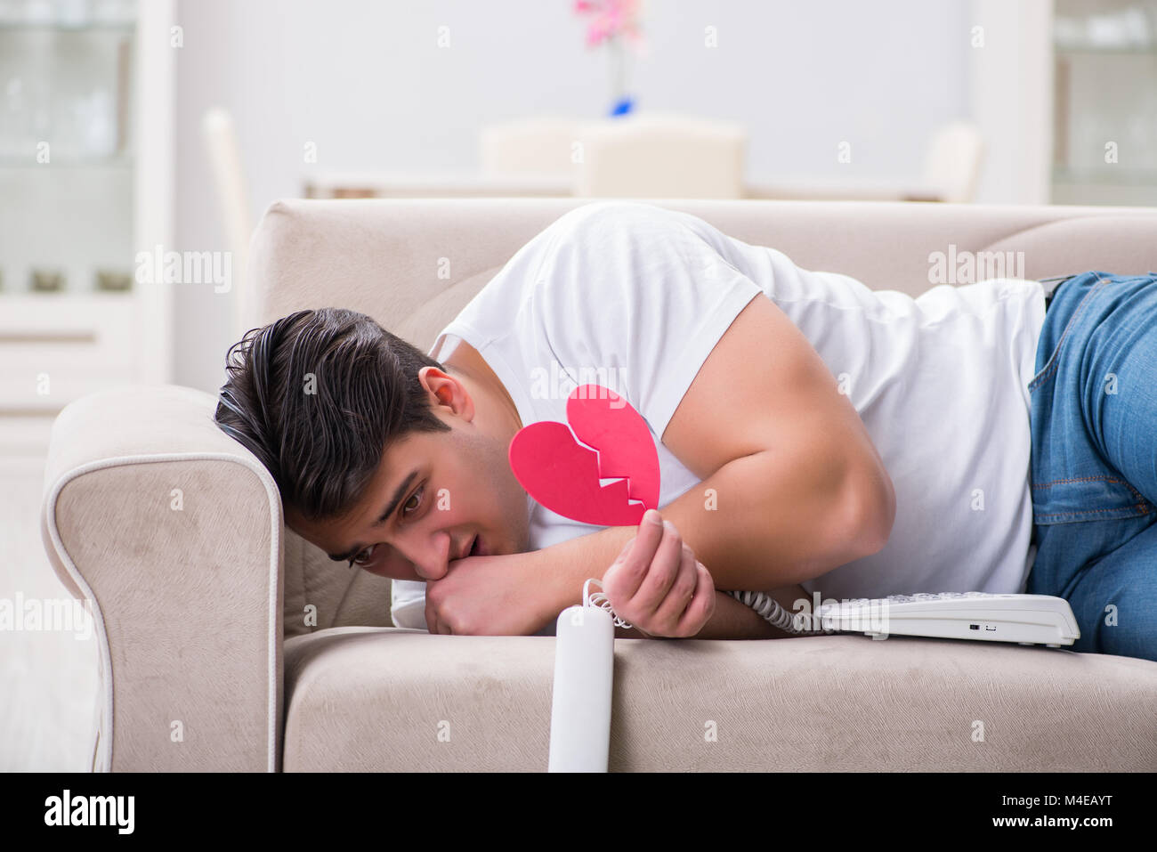 Young man in sad saint valentine concept Stock Photo - Alamy