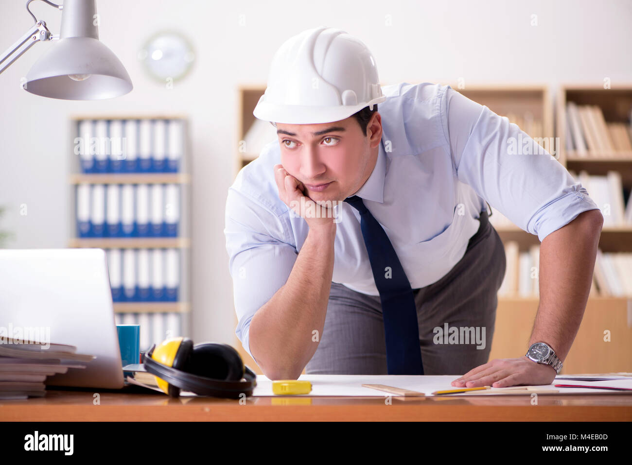 Engineer supervisor working on drawings in the office Stock Photo - Alamy
