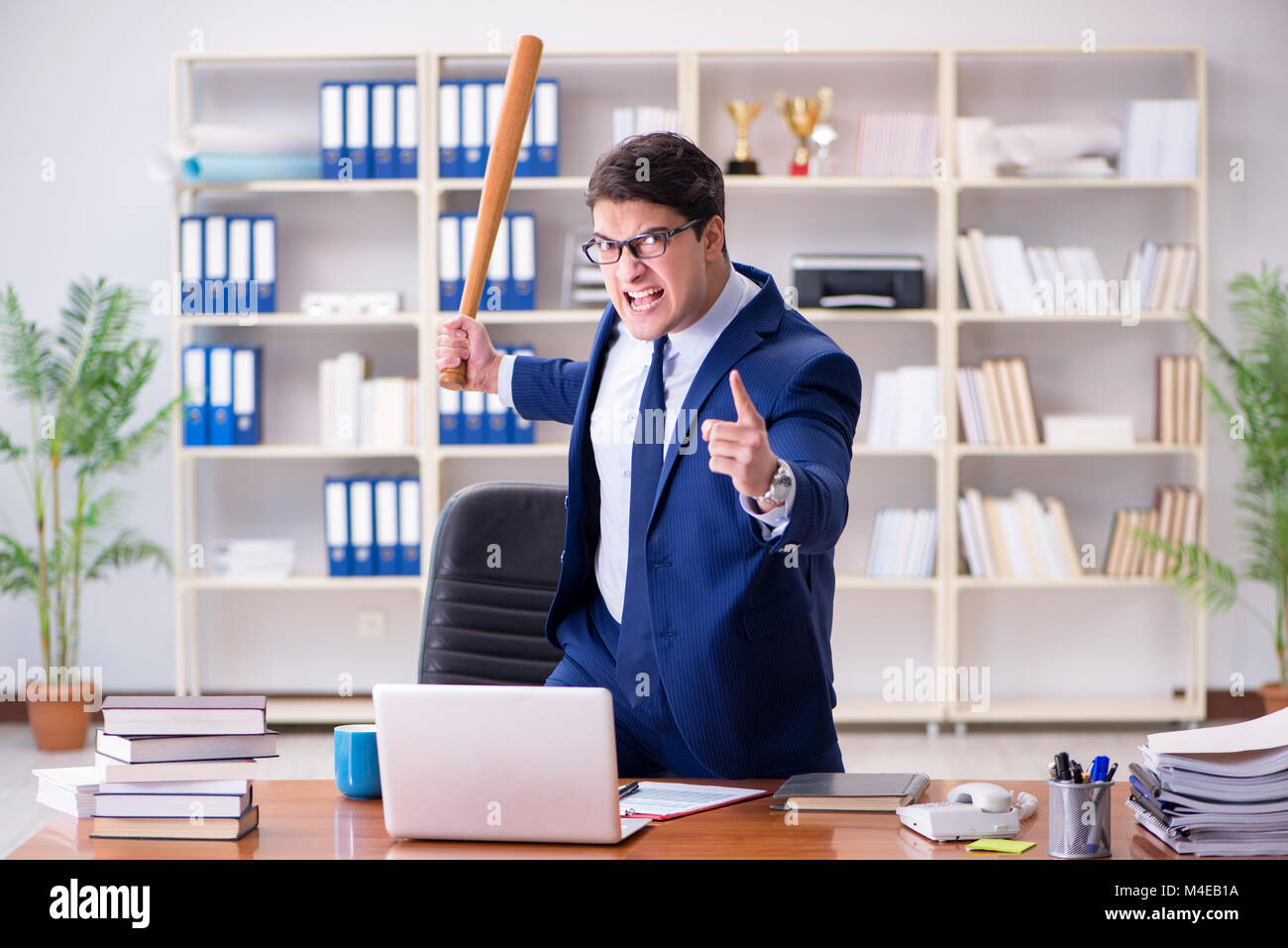 Angry aggressive businessman in the office Stock Photo - Alamy
