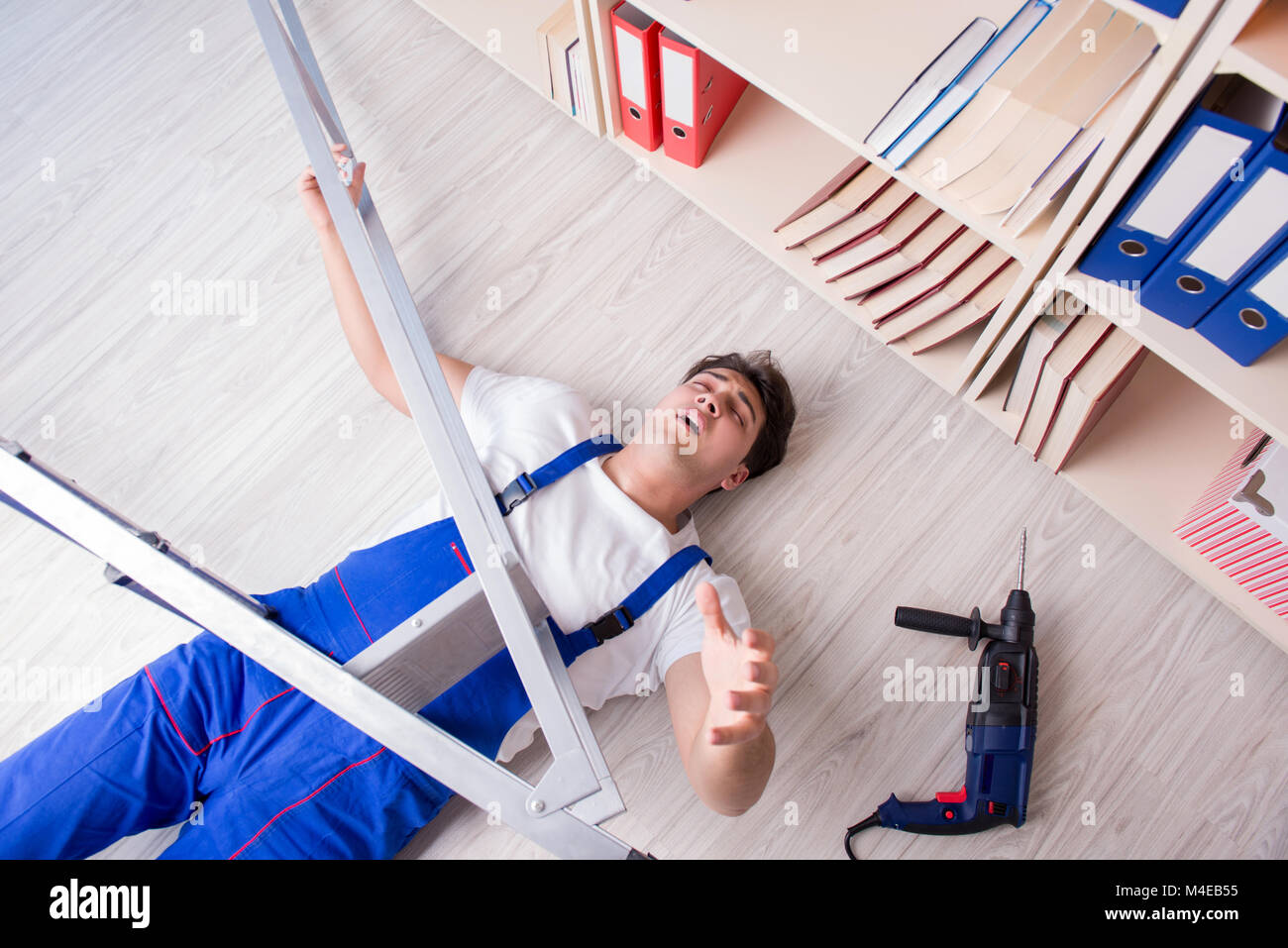 Unsafe behavior concept with falling worker Stock Photo - Alamy