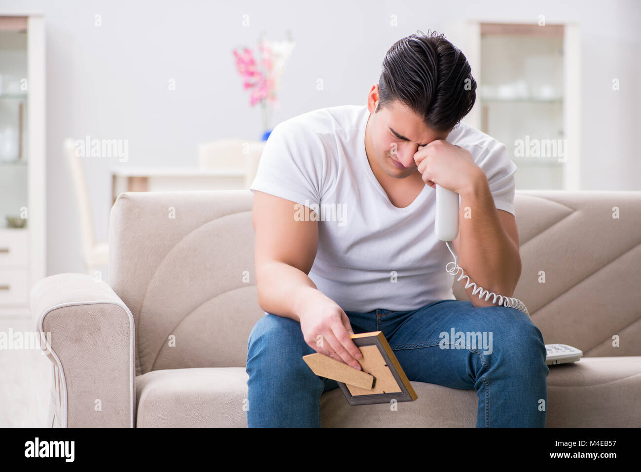 Young man in sad saint valentine concept Stock Photo - Alamy