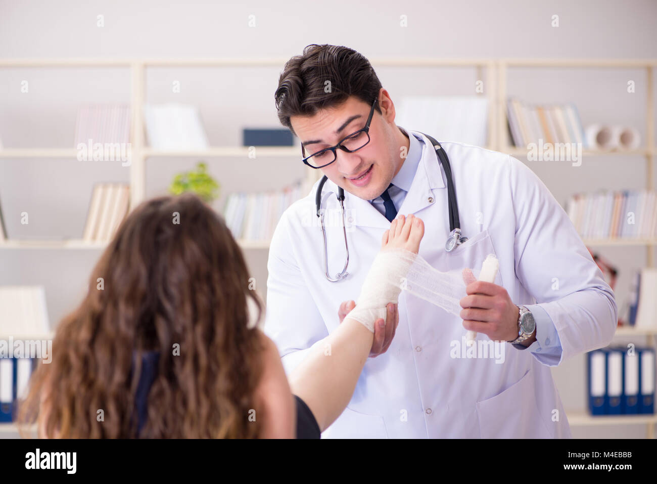 Traumatologist is taking care of the patient Stock Photo - Alamy