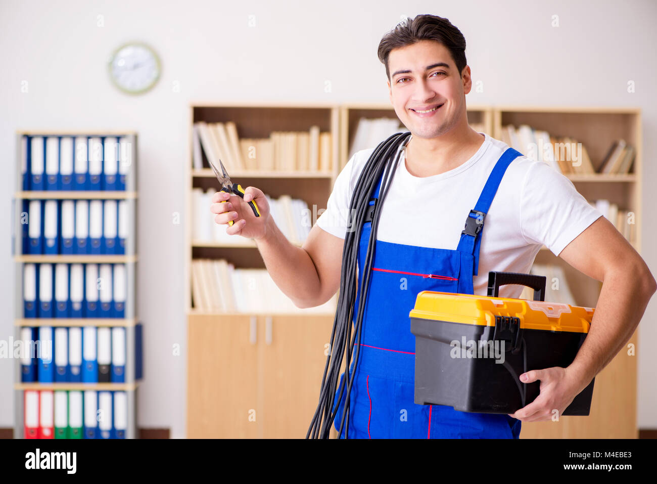 Man doing electrical repairs at home Stock Photo - Alamy