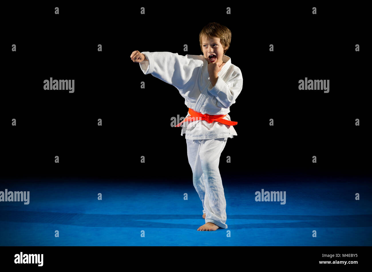 Little boy martial arts fighter isolated Stock Photo - Alamy