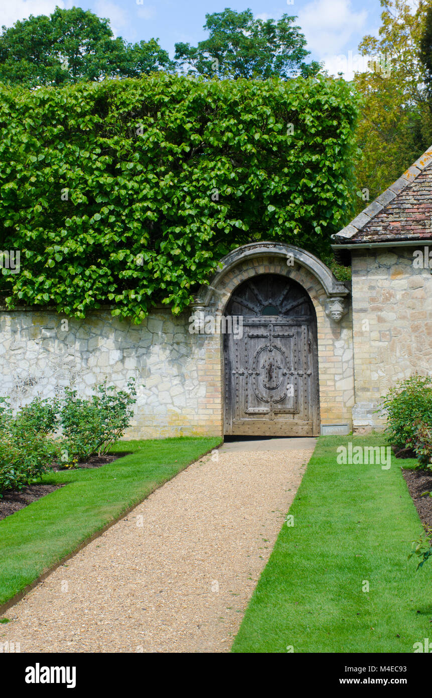 Path to gate in English garden Stock Photo - Alamy