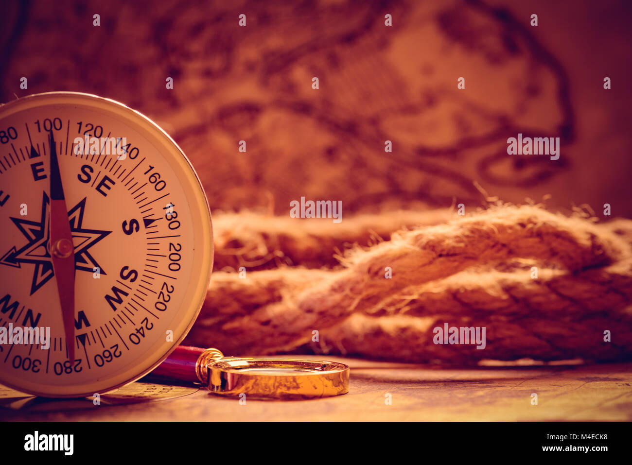 Vintage compass with rope Stock Photo - Alamy