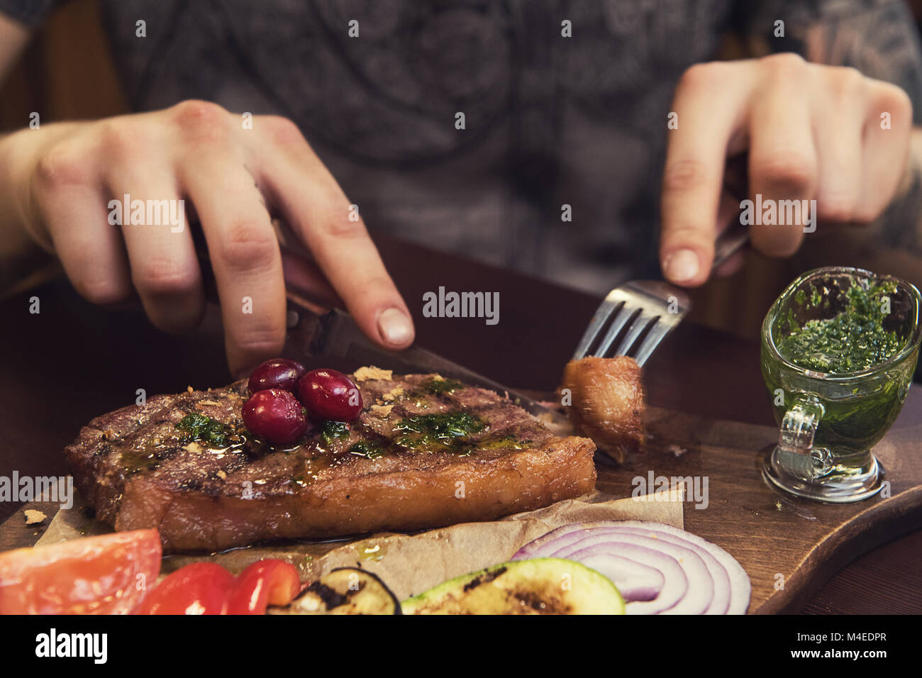 Big steak fork and hand hi-res stock photography and images - Alamy