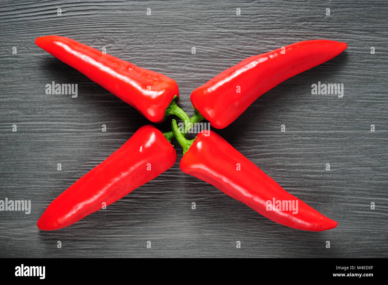 Sweet red Kapia peppers on a dark shale Stock Photo - Alamy