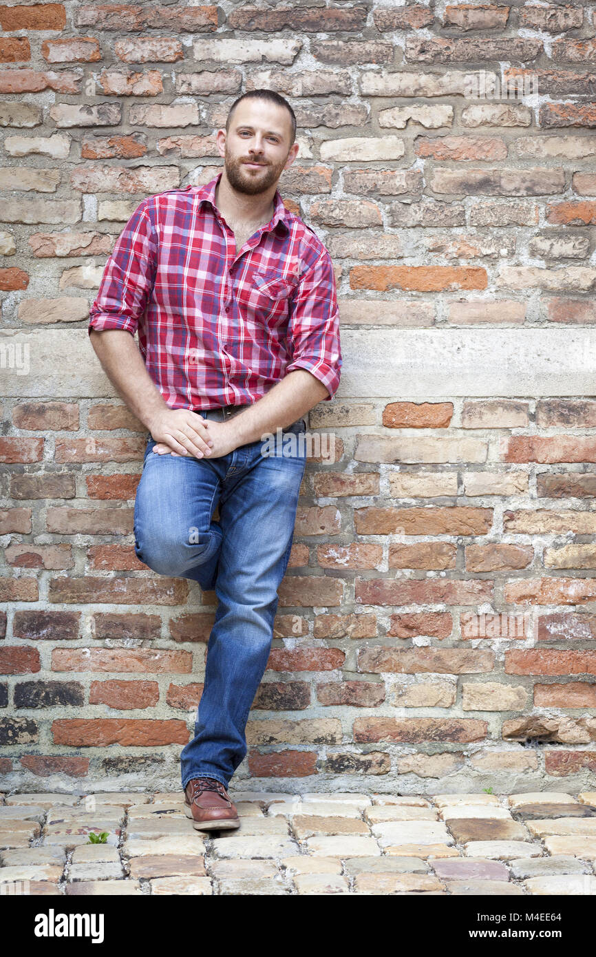 Man portrait brick wall hi-res stock photography and images - Alamy