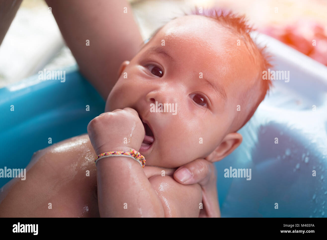 Infant washing hi-res stock photography and images - Alamy
