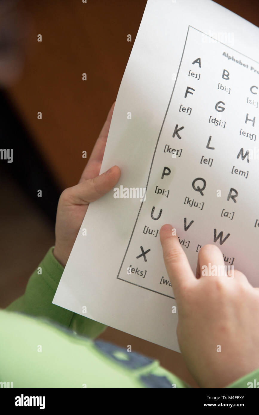Boy learning the alphabet Stock Photo - Alamy