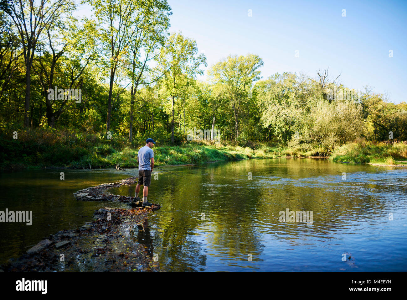 Fishing rod fisherman hi-res stock photography and images - Alamy