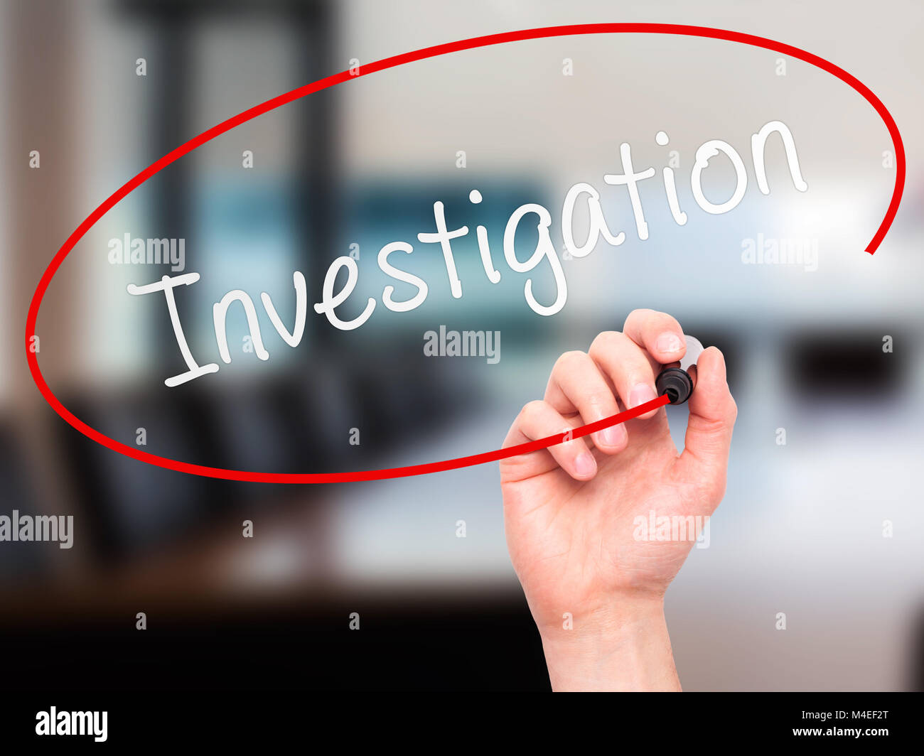 Man Hand writing Investigation with marker on transparent wipe board ...