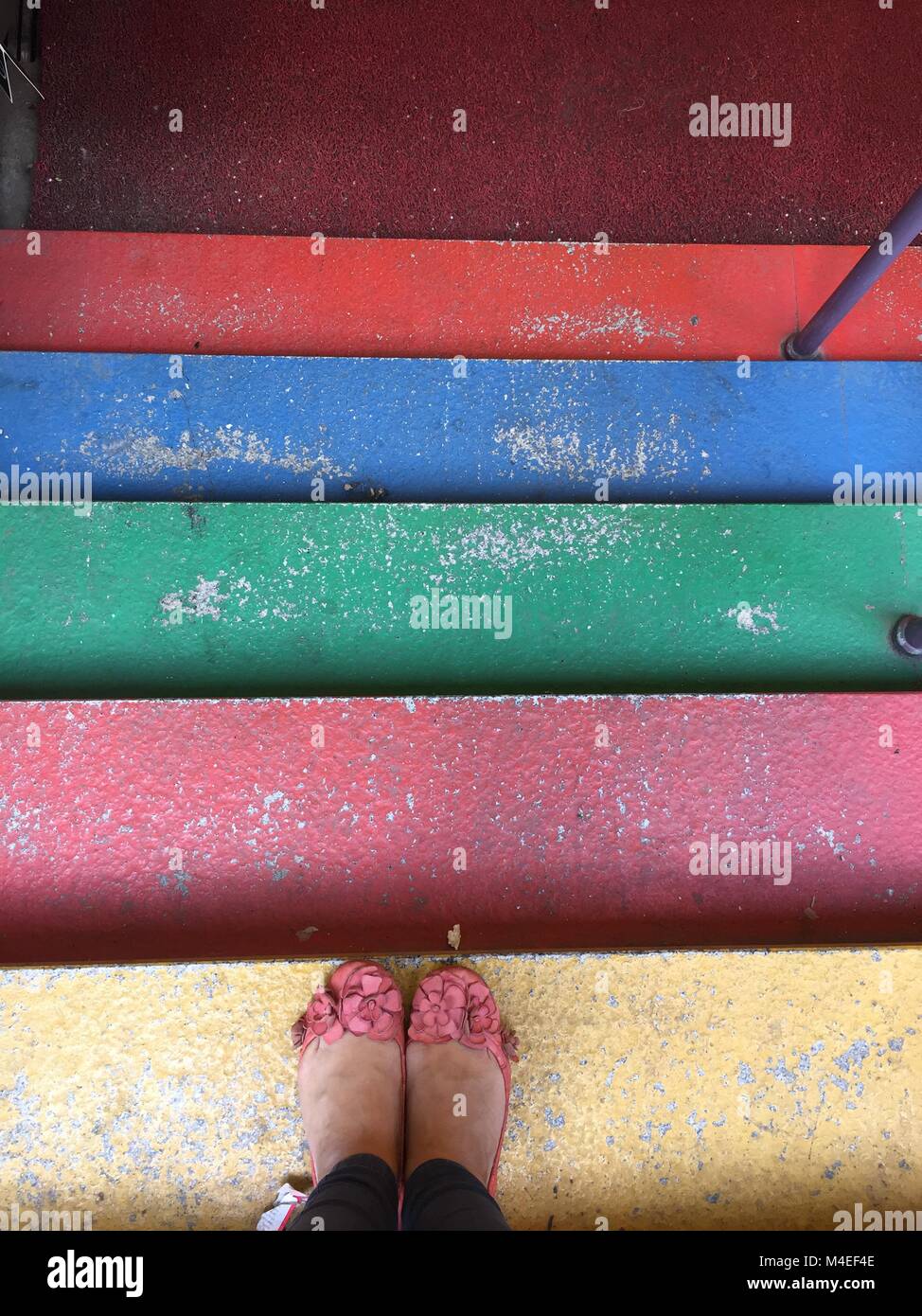 Woman's feet standing at the top of rainbow stairs Stock Photo - Alamy