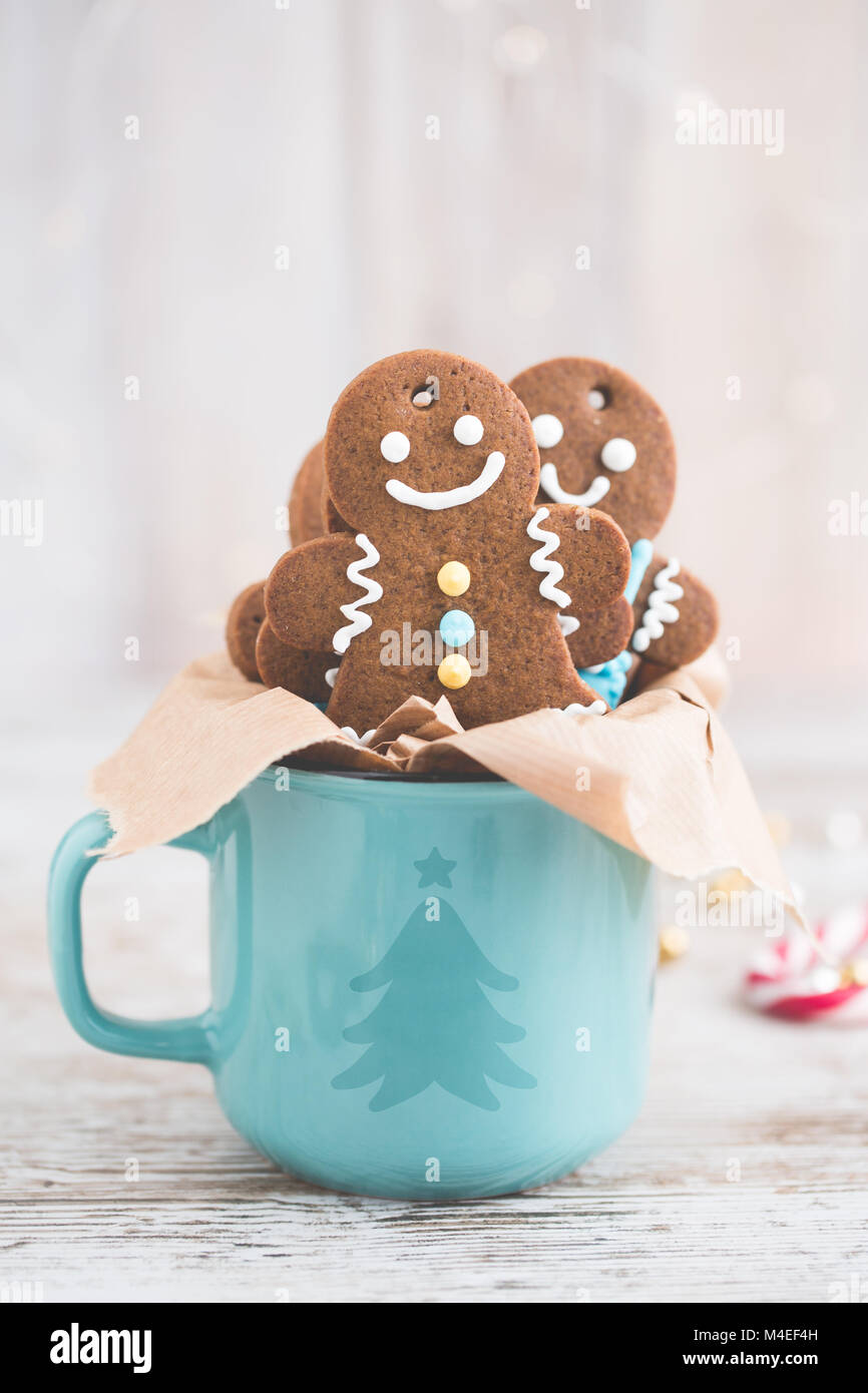 Gingerbread man cookies in a Christmas mug Stock Photo - Alamy