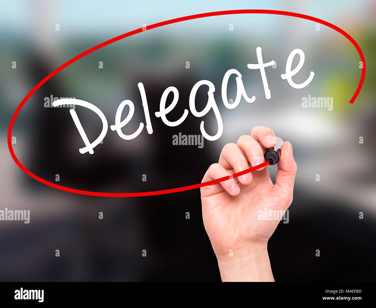 Man Hand writing Delegate with black marker on visual screen Stock ...
