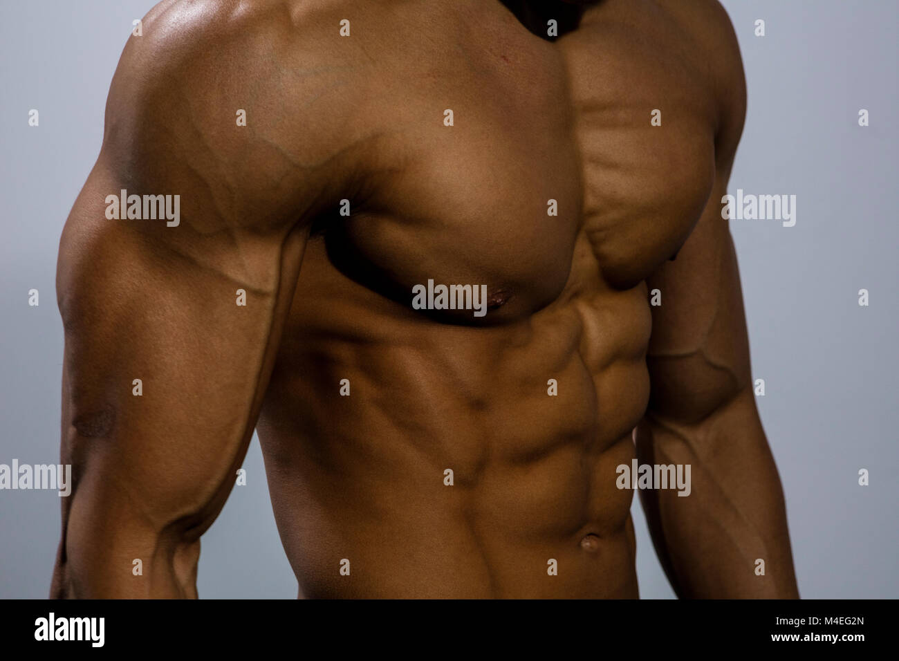 A fitness model torso with the chest muscles tightly flexed. Close up ...