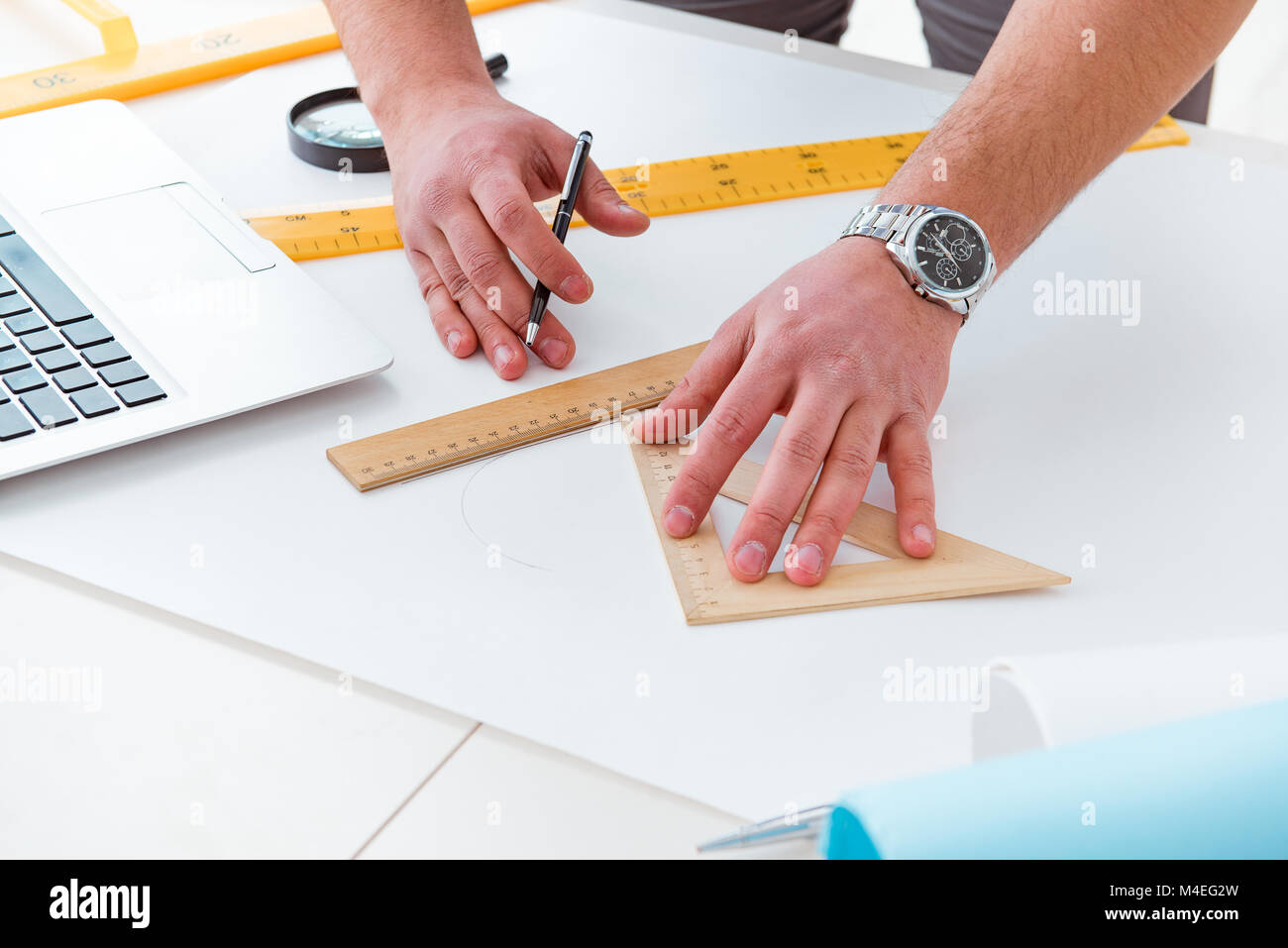 Male engineer working on drawings and blueprints Stock Photo - Alamy