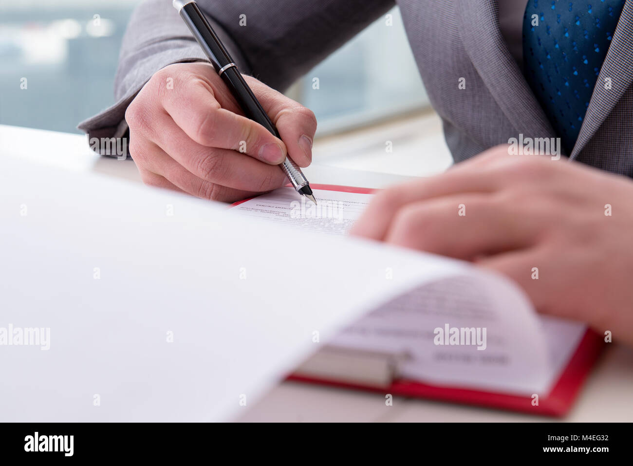 Businessman taking notes at the meeting Stock Photo - Alamy
