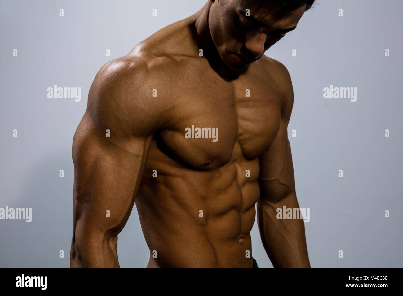 A fitness model torso with the chest muscles tightly flexed. Close up ...
