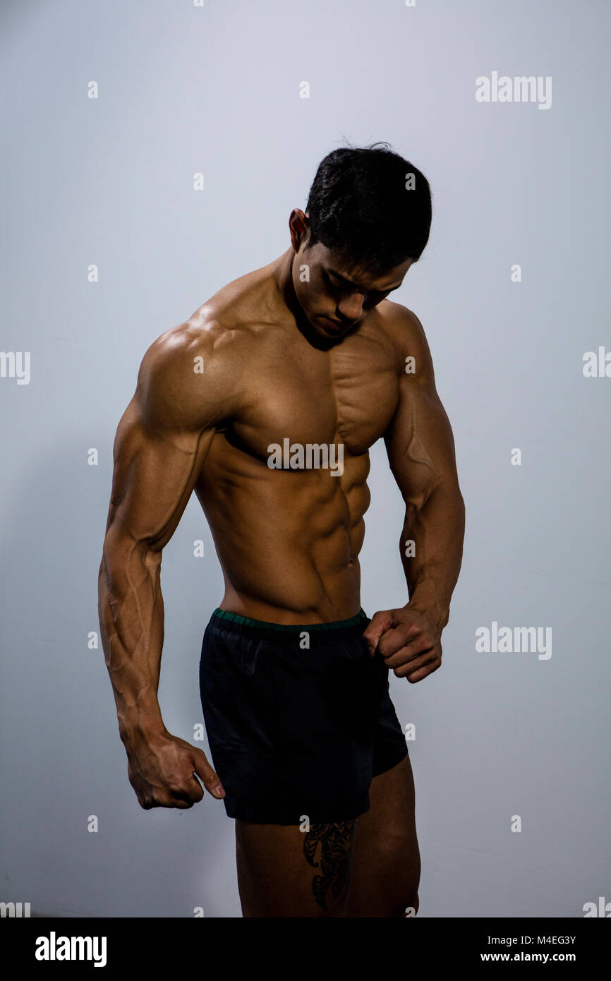 A fitness model torso with the chest muscles tightly flexed. Medium ...