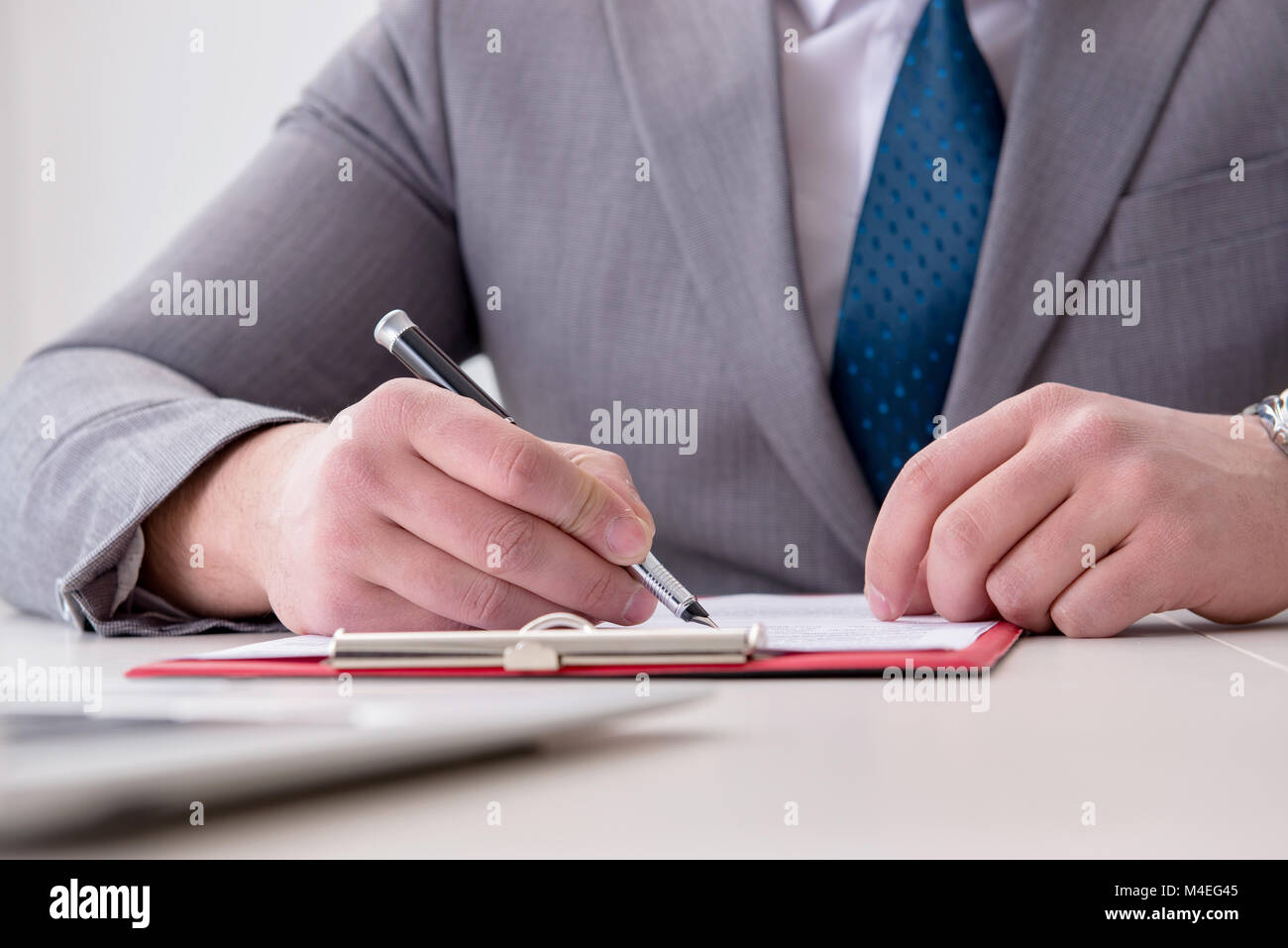 Businessman taking notes at the meeting Stock Photo - Alamy