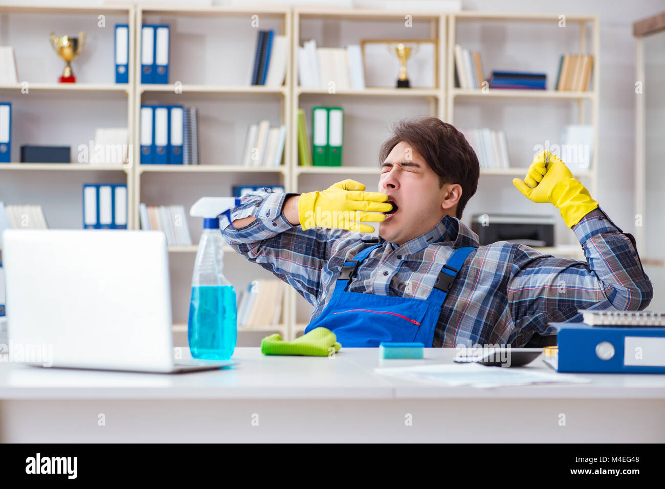 Male cleaner working in the office Stock Photo - Alamy