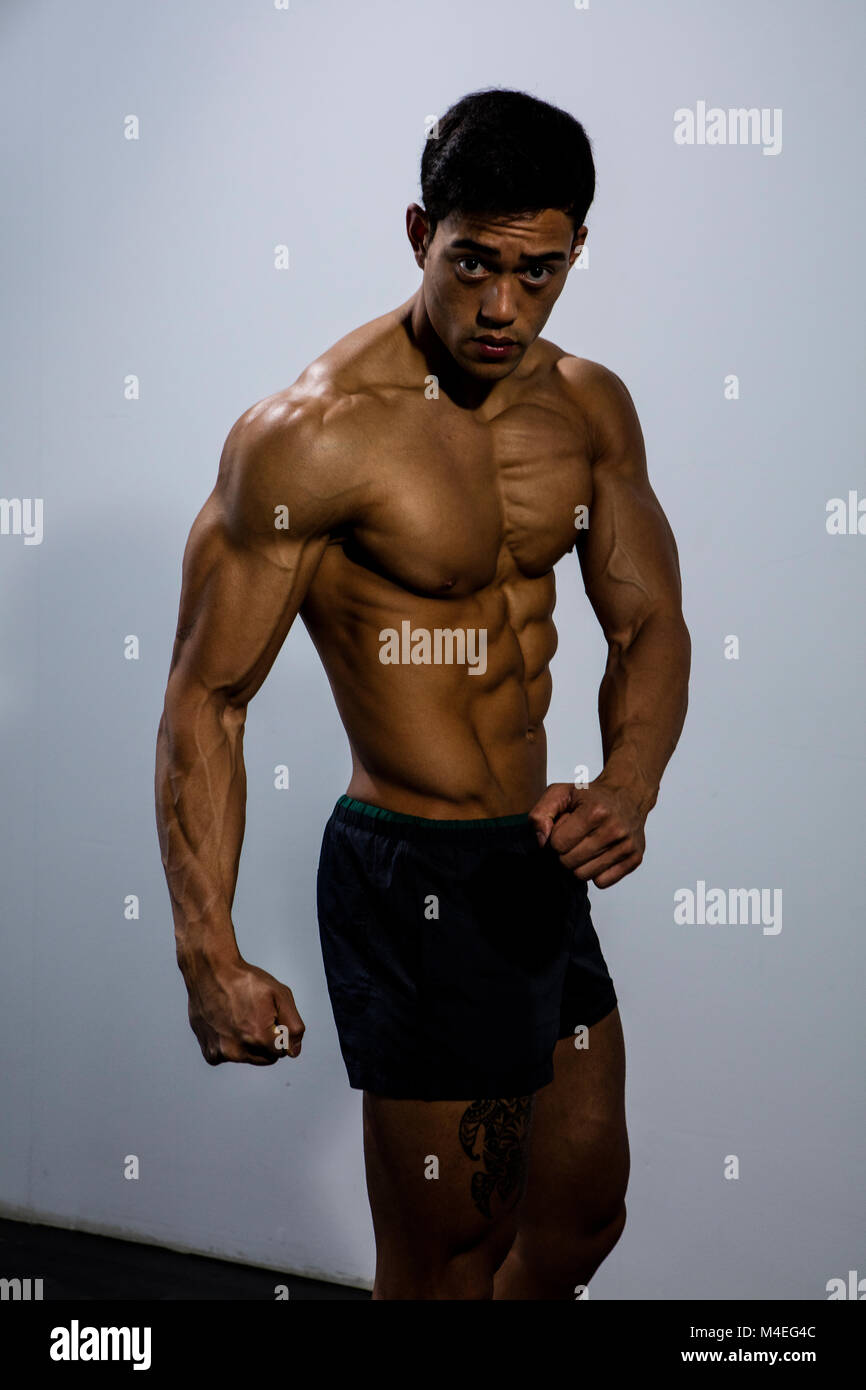 A fitness model torso with the chest muscles tightly flexed. Medium ...