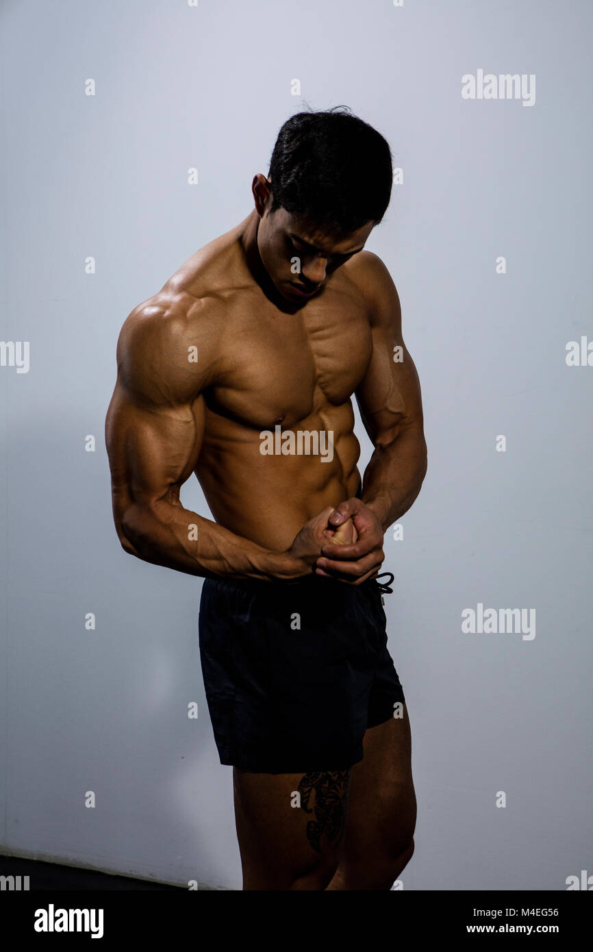 A fitness model torso with the chest muscles tightly flexed. Medium ...