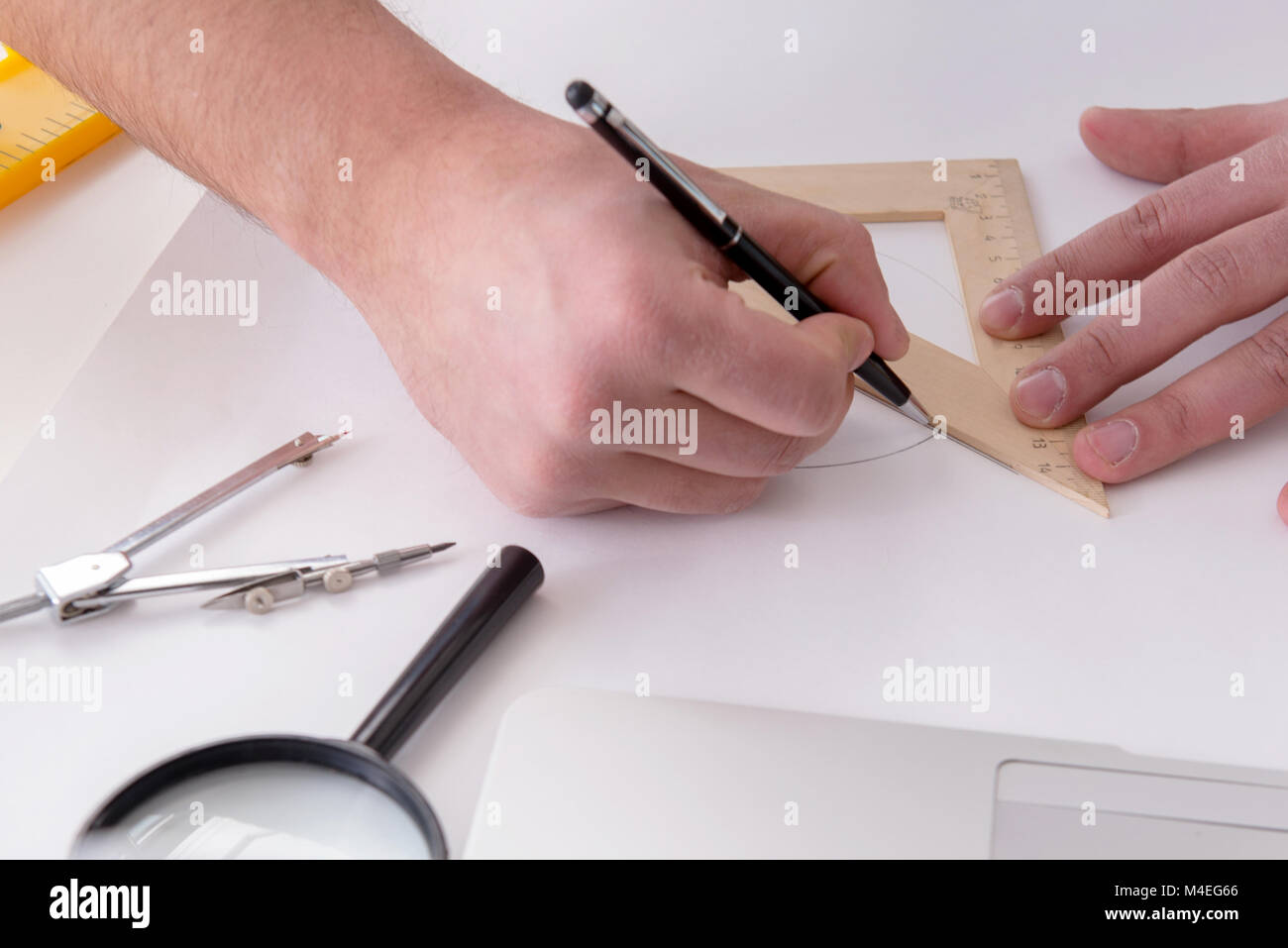 Male engineer working on drawings and blueprints Stock Photo - Alamy