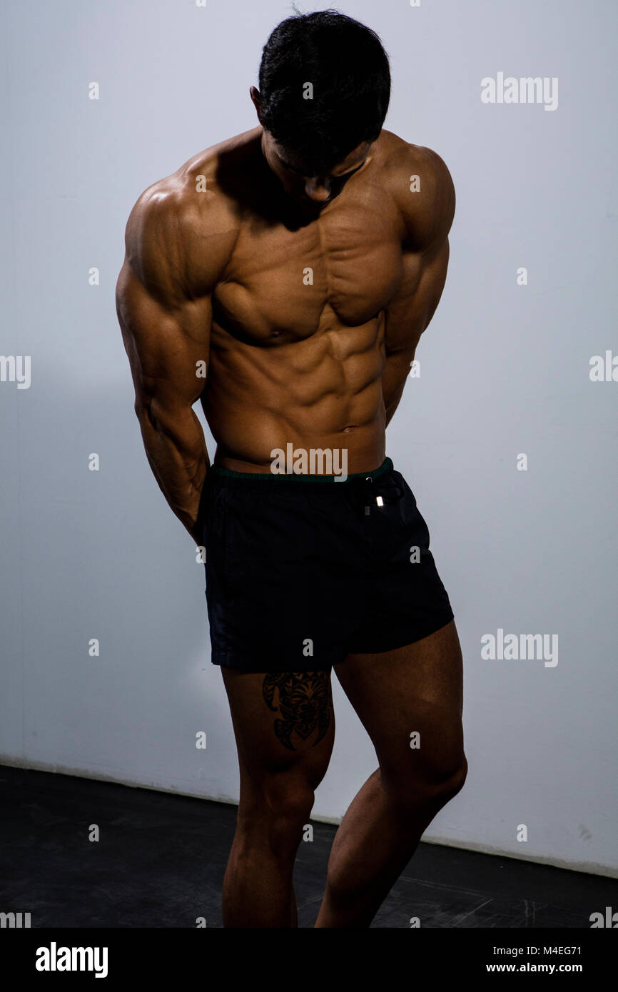 A fitness model torso with the chest muscles tightly flexed. Medium ...