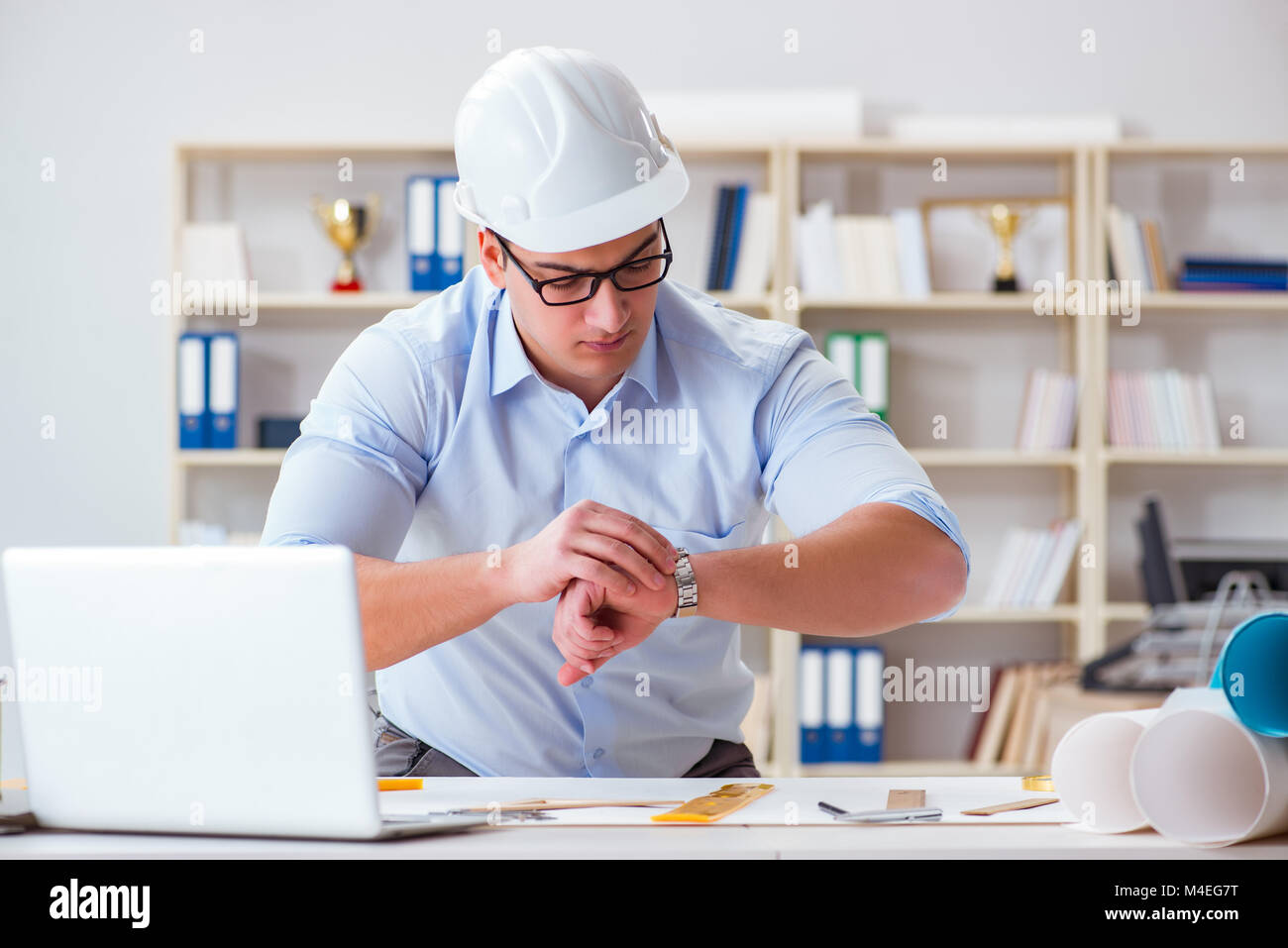 Male engineer working on drawings and blueprints Stock Photo - Alamy