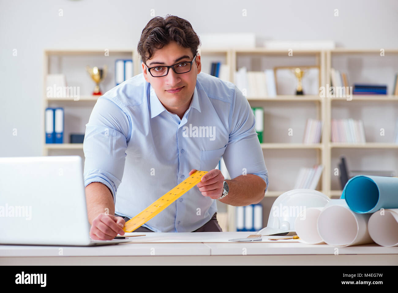 Male engineer working on drawings and blueprints Stock Photo - Alamy