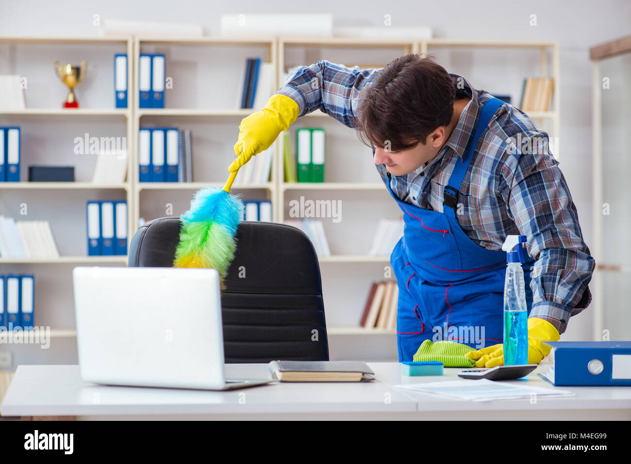 Male cleaner working in the office Stock Photo - Alamy