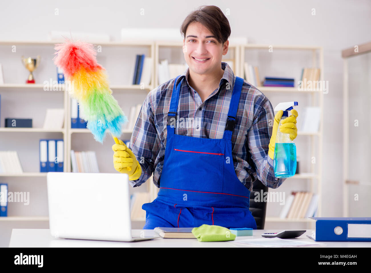 Male cleaner working in the office Stock Photo - Alamy