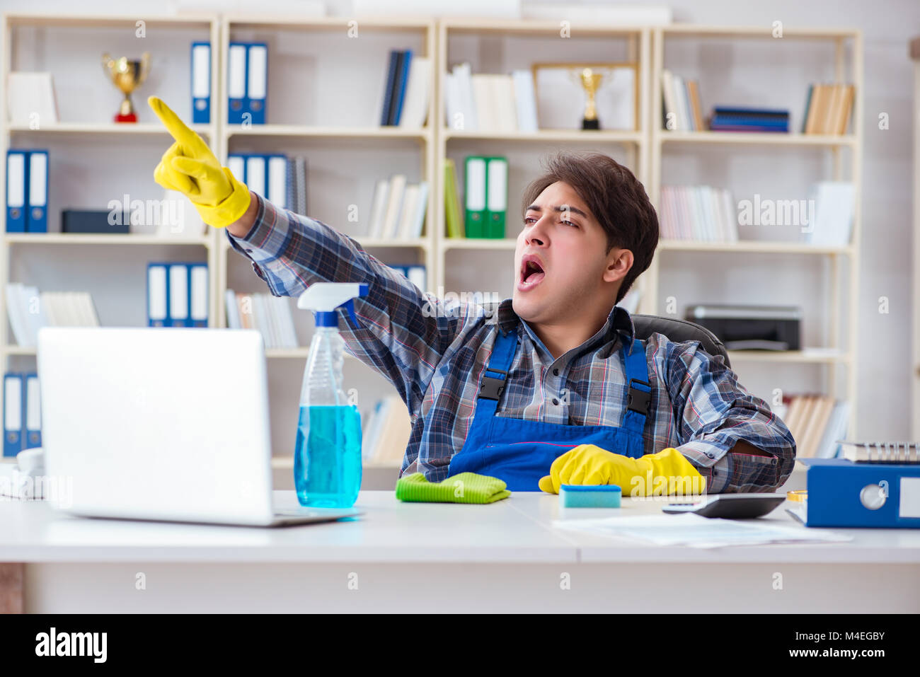 Male cleaner working in the office Stock Photo - Alamy
