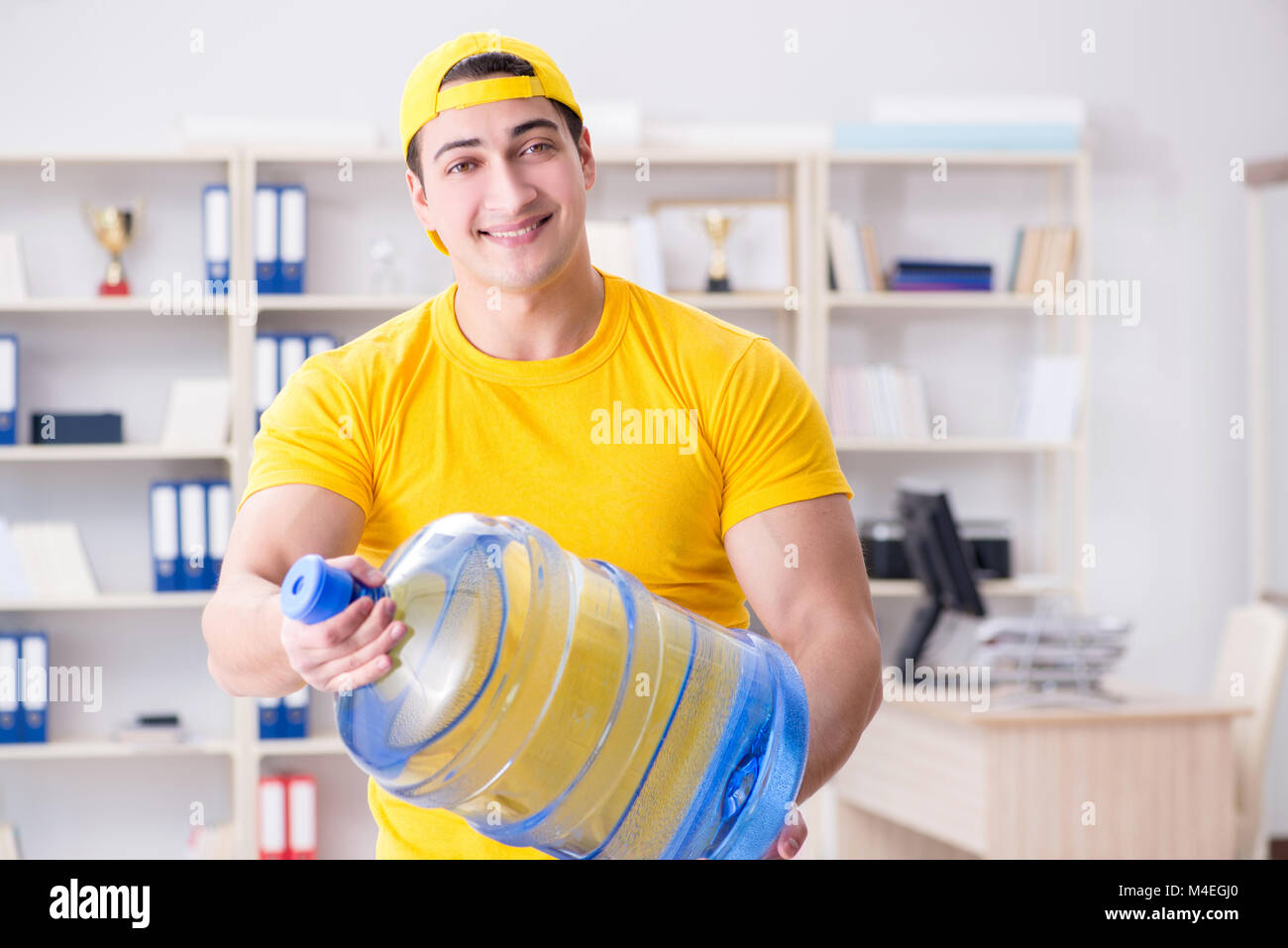 Man delivering water bottle to the office Stock Photo - Alamy