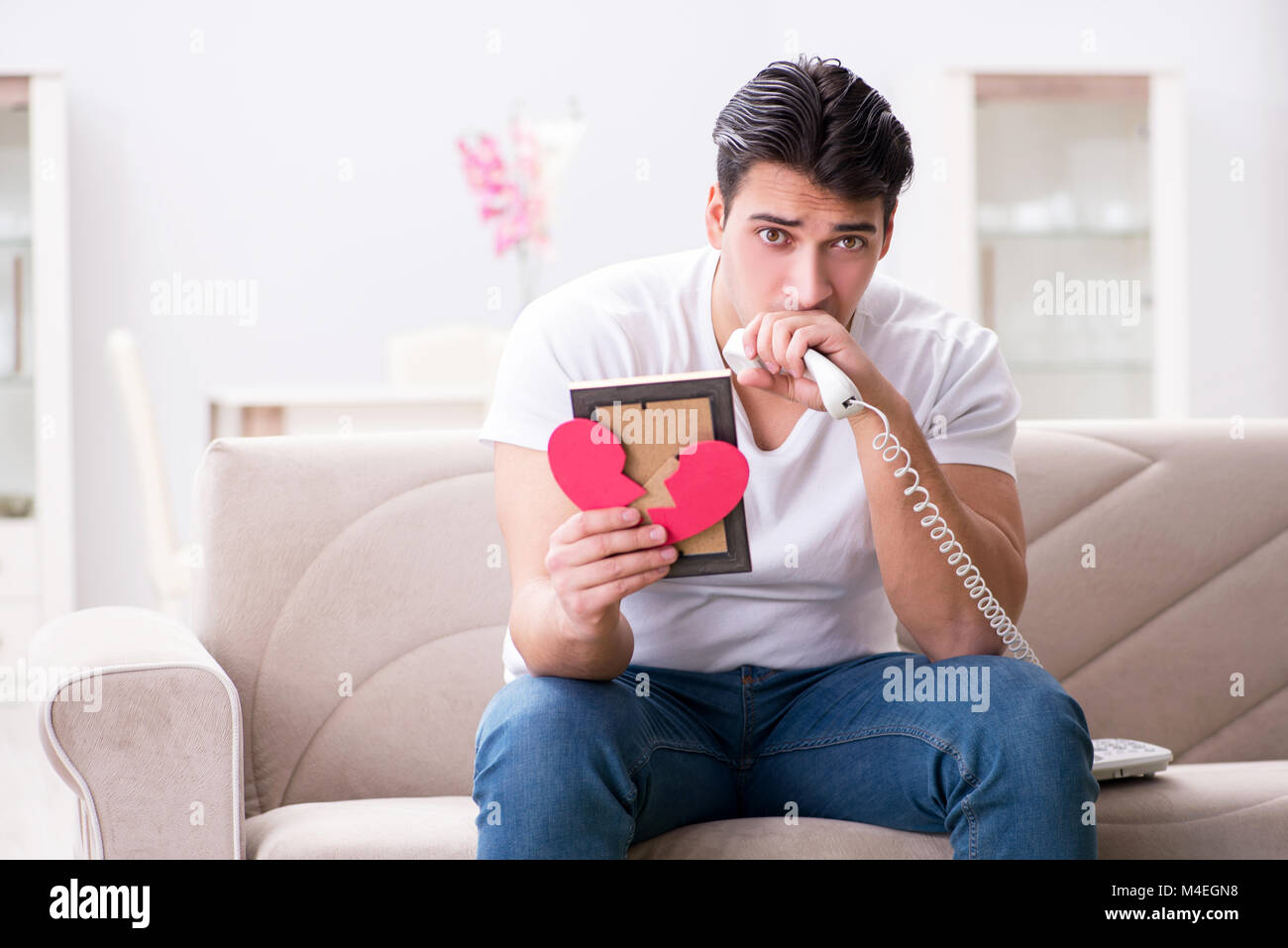 Young man in sad saint valentine concept Stock Photo - Alamy