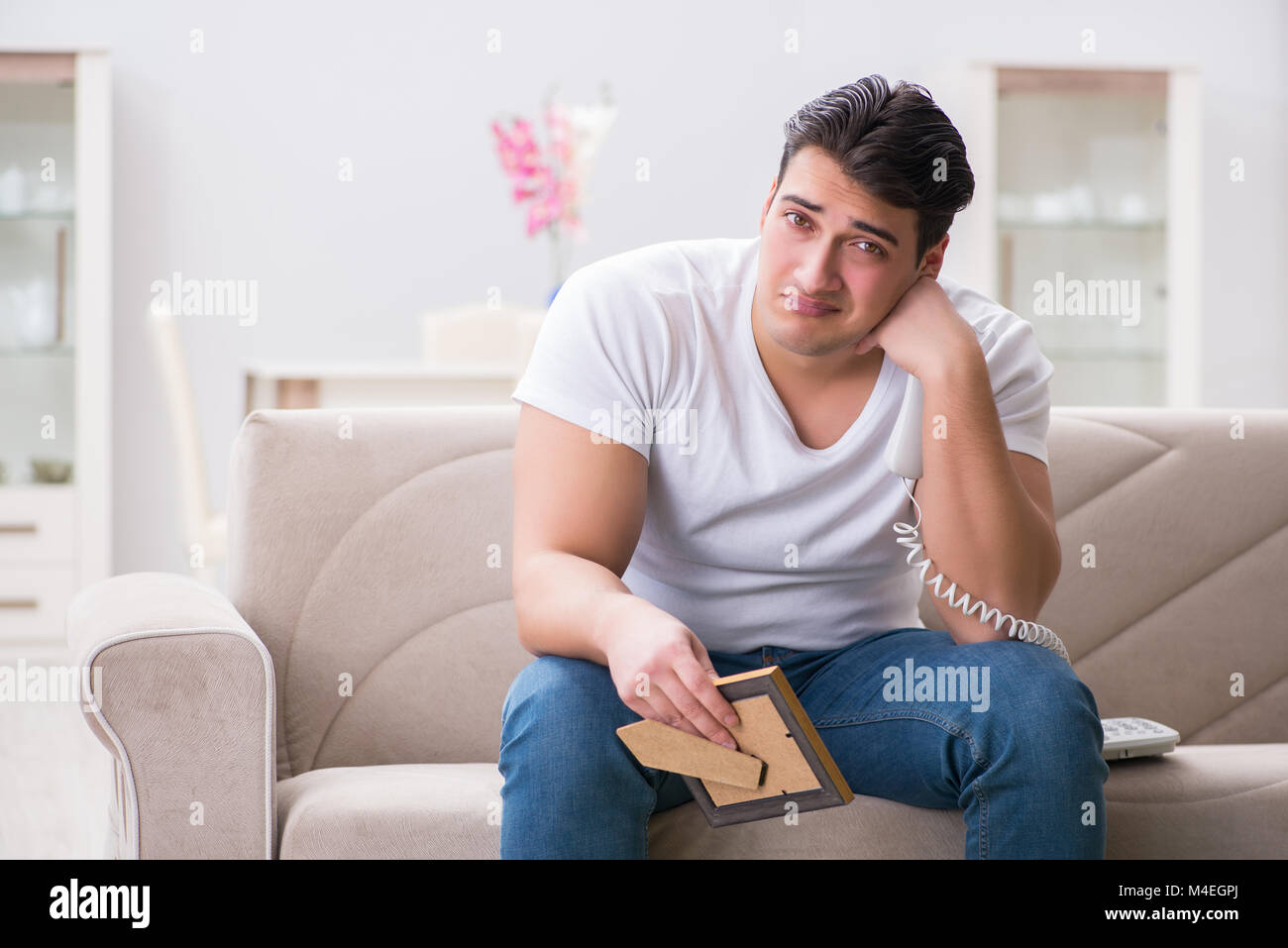 Young man in sad saint valentine concept Stock Photo - Alamy