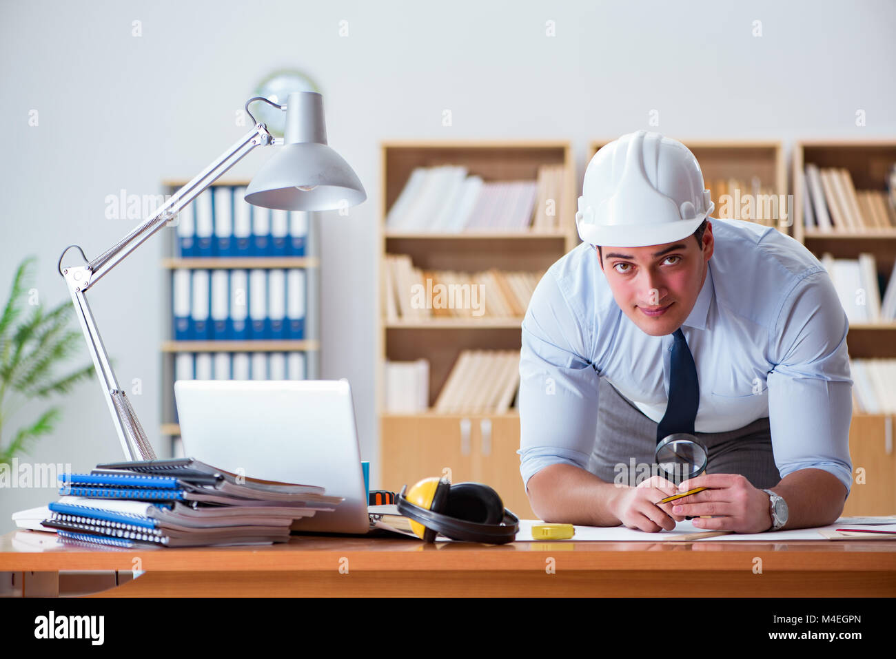 Engineer supervisor working on drawings in the office Stock Photo - Alamy