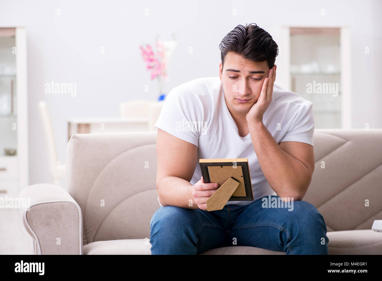 Young man in sad saint valentine concept Stock Photo - Alamy