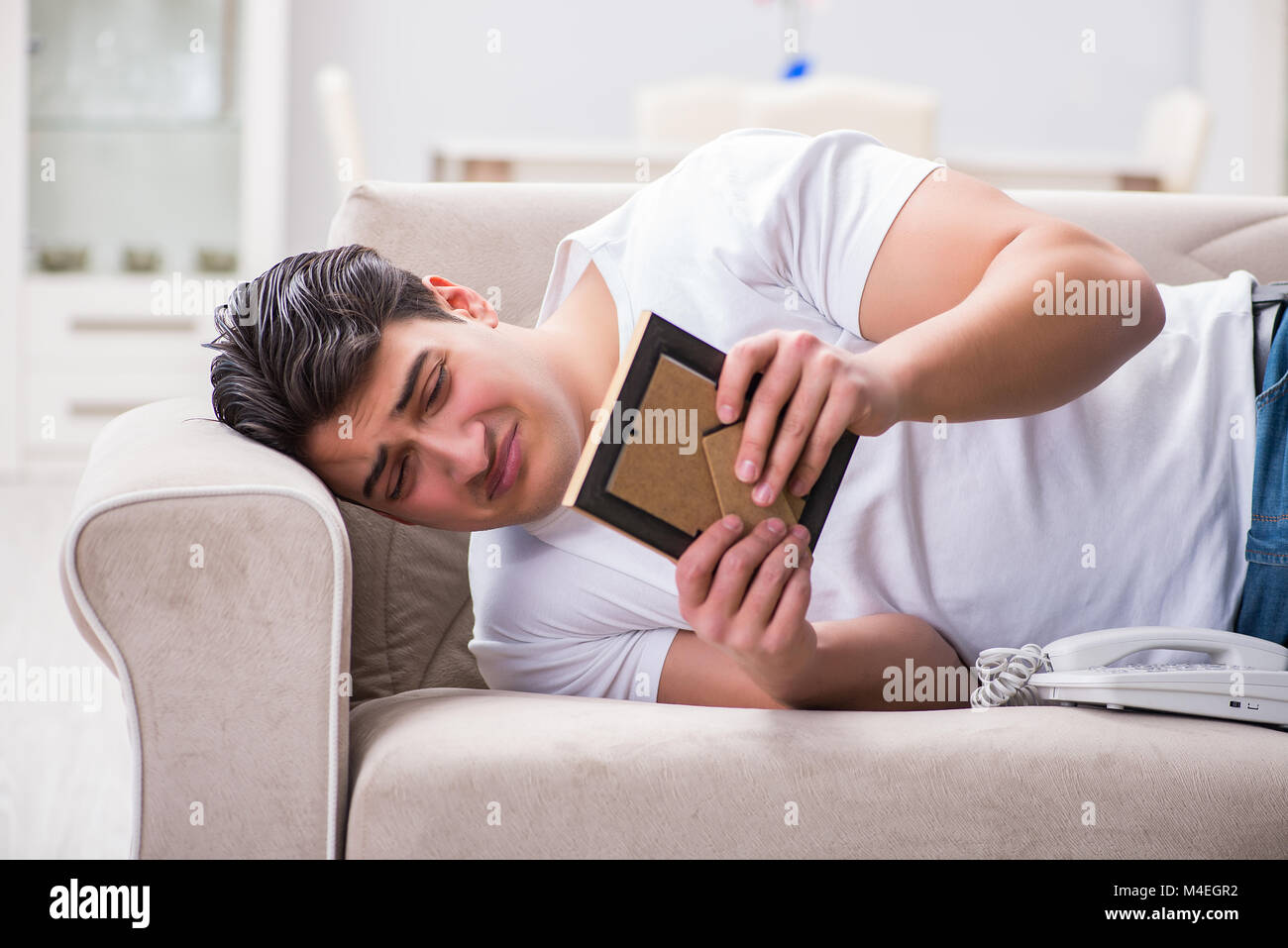 Young man in sad saint valentine concept Stock Photo - Alamy