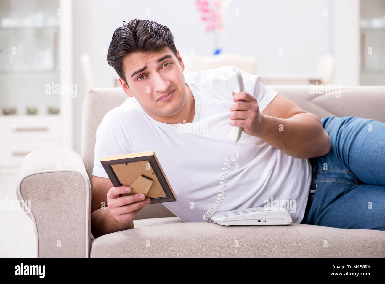 Young man in sad saint valentine concept Stock Photo - Alamy